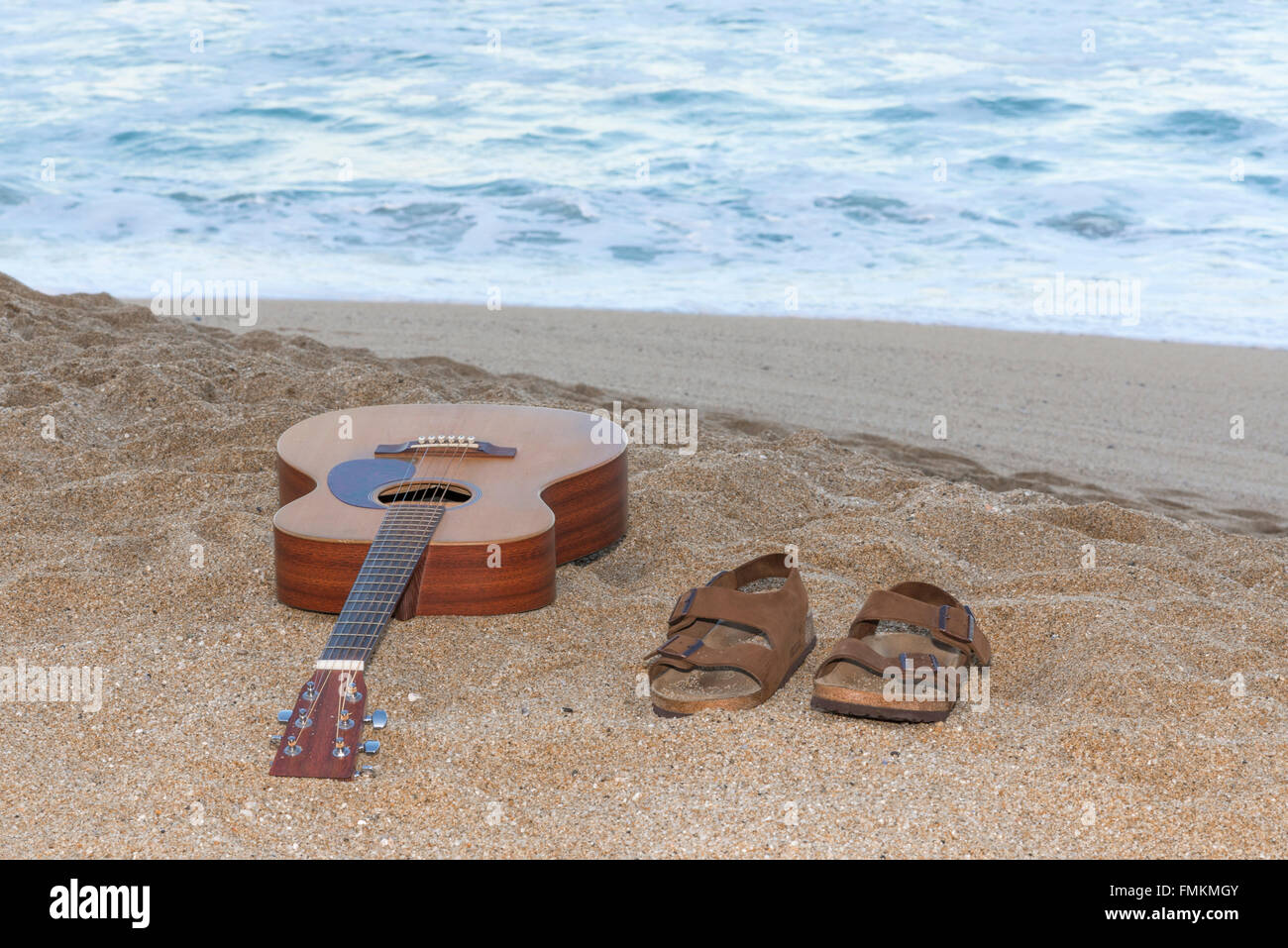 Acoustic guitar on the beach Stock Photo - Alamy