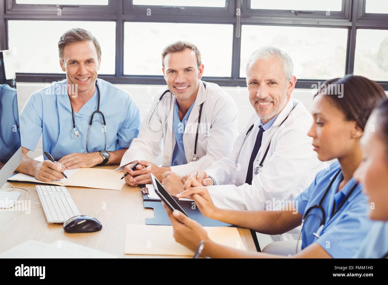 Portrait of doctors smiling in conference room Stock Photo - Alamy