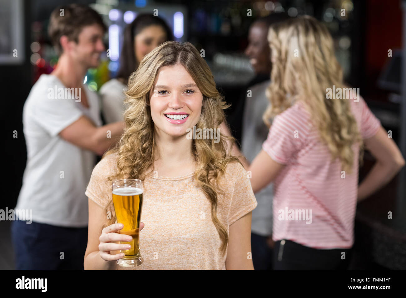 Smiling friends having beers hi-res stock photography and images - Alamy