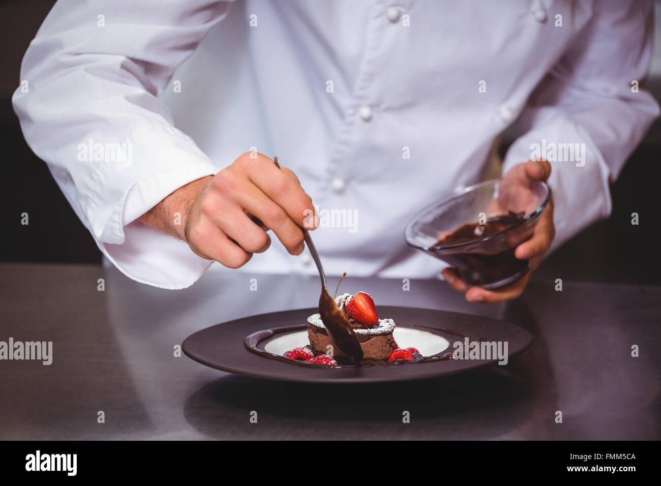 Chef putting chocolate sauce hi-res stock photography and images - Alamy