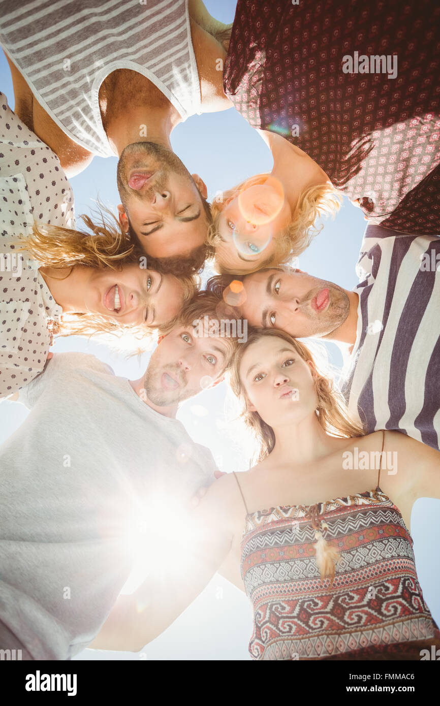 Group of friends forming a huddle Stock Photo - Alamy