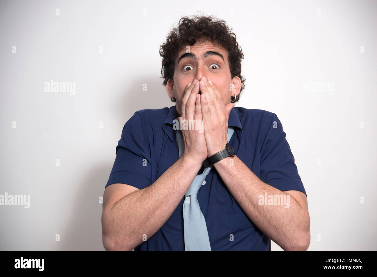 Portrait of young man surprised astonished Stock Photo - Alamy