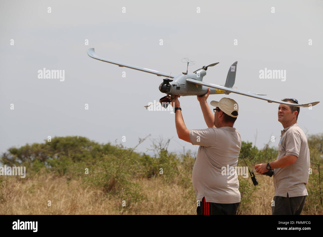 Two Air Shepherd pilots prepare a drone for take-off in the Hluhluwe ...