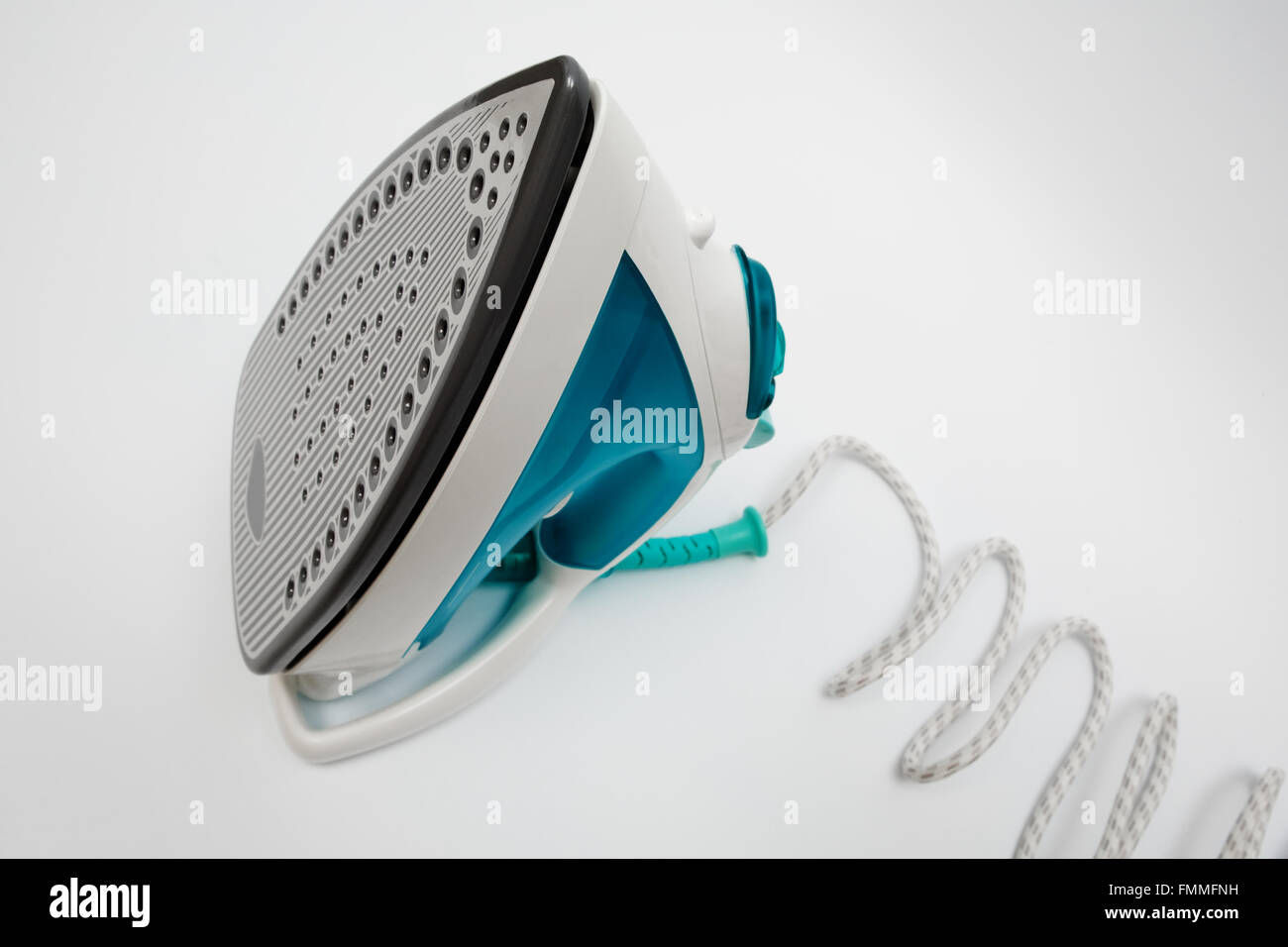New and modern iron with a teflon covering Stock Photo - Alamy
