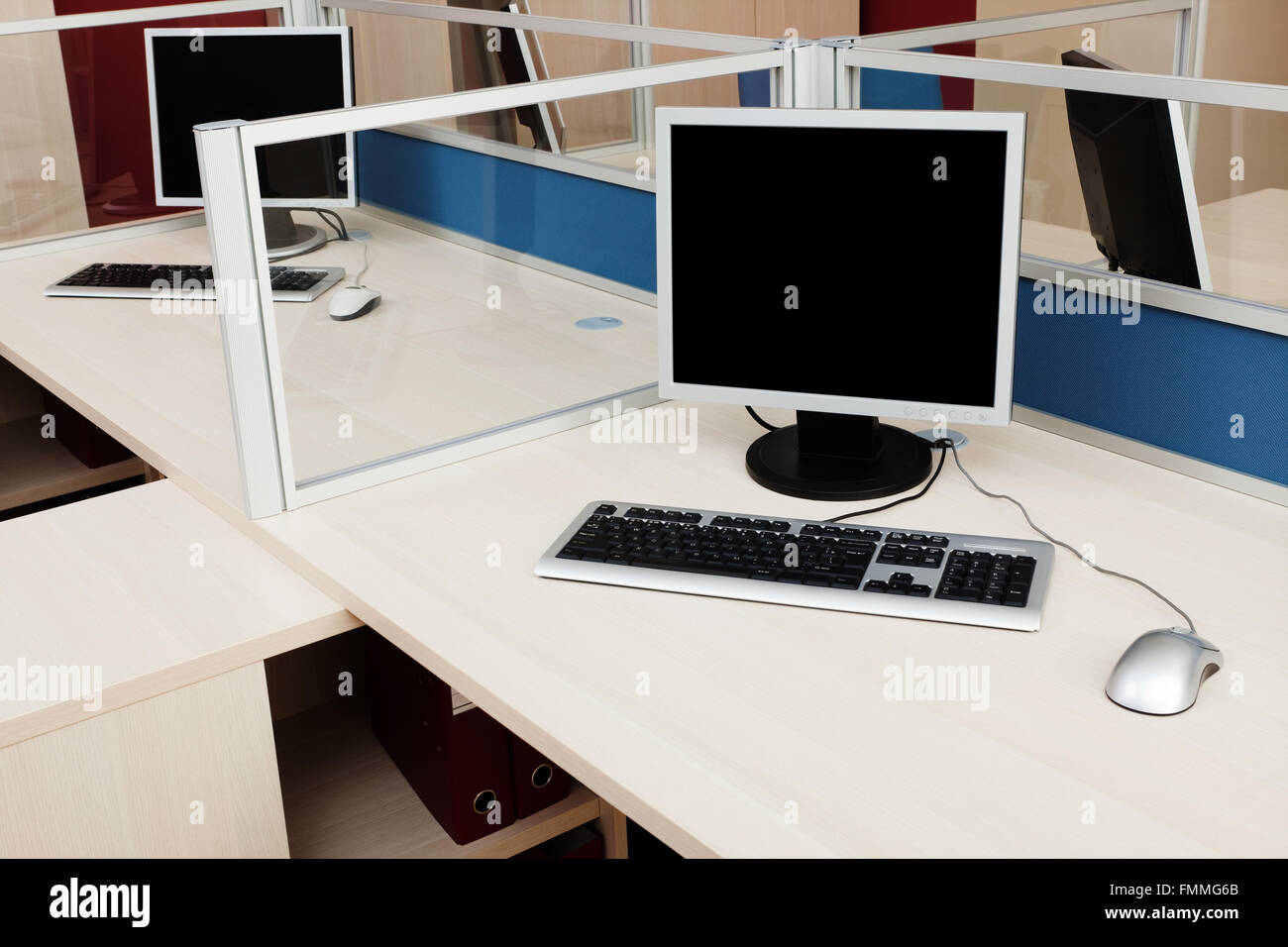 computers behind the glass in a modern office Stock Photo - Alamy