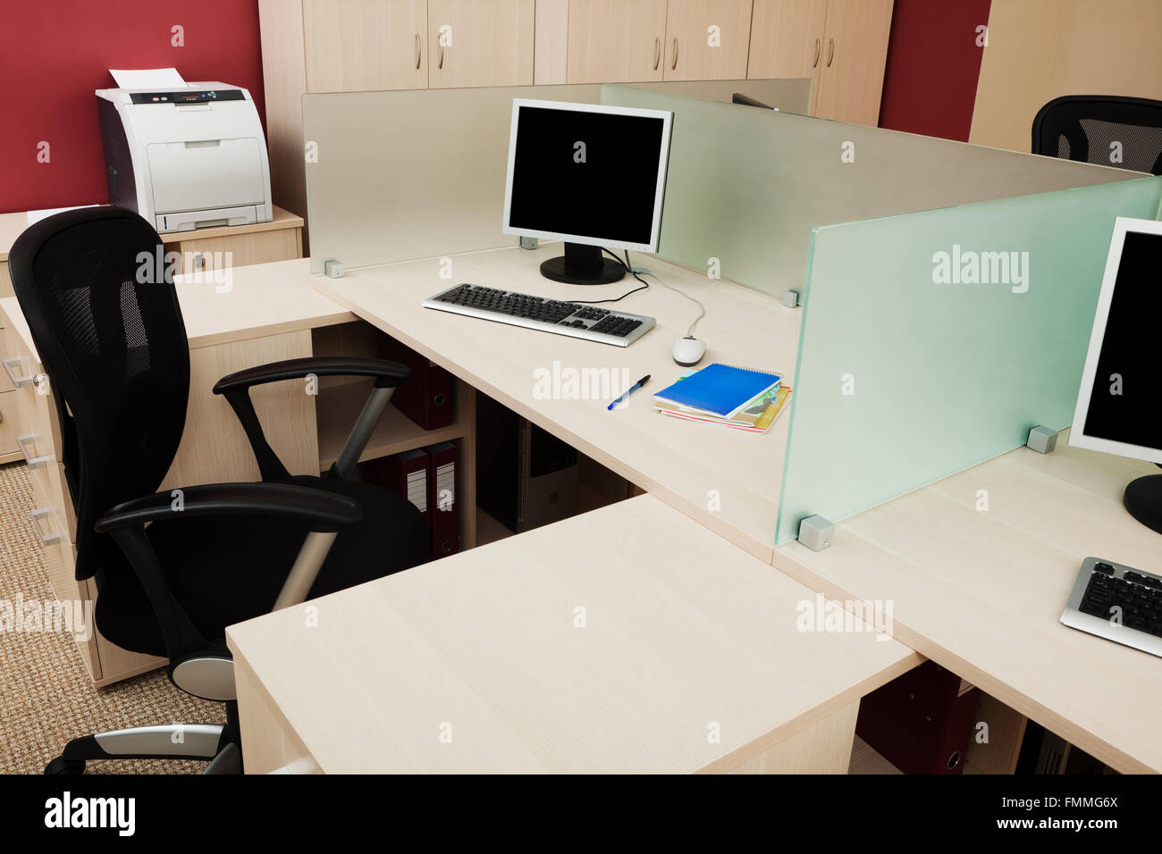 computers behind the glass in a modern office Stock Photo - Alamy
