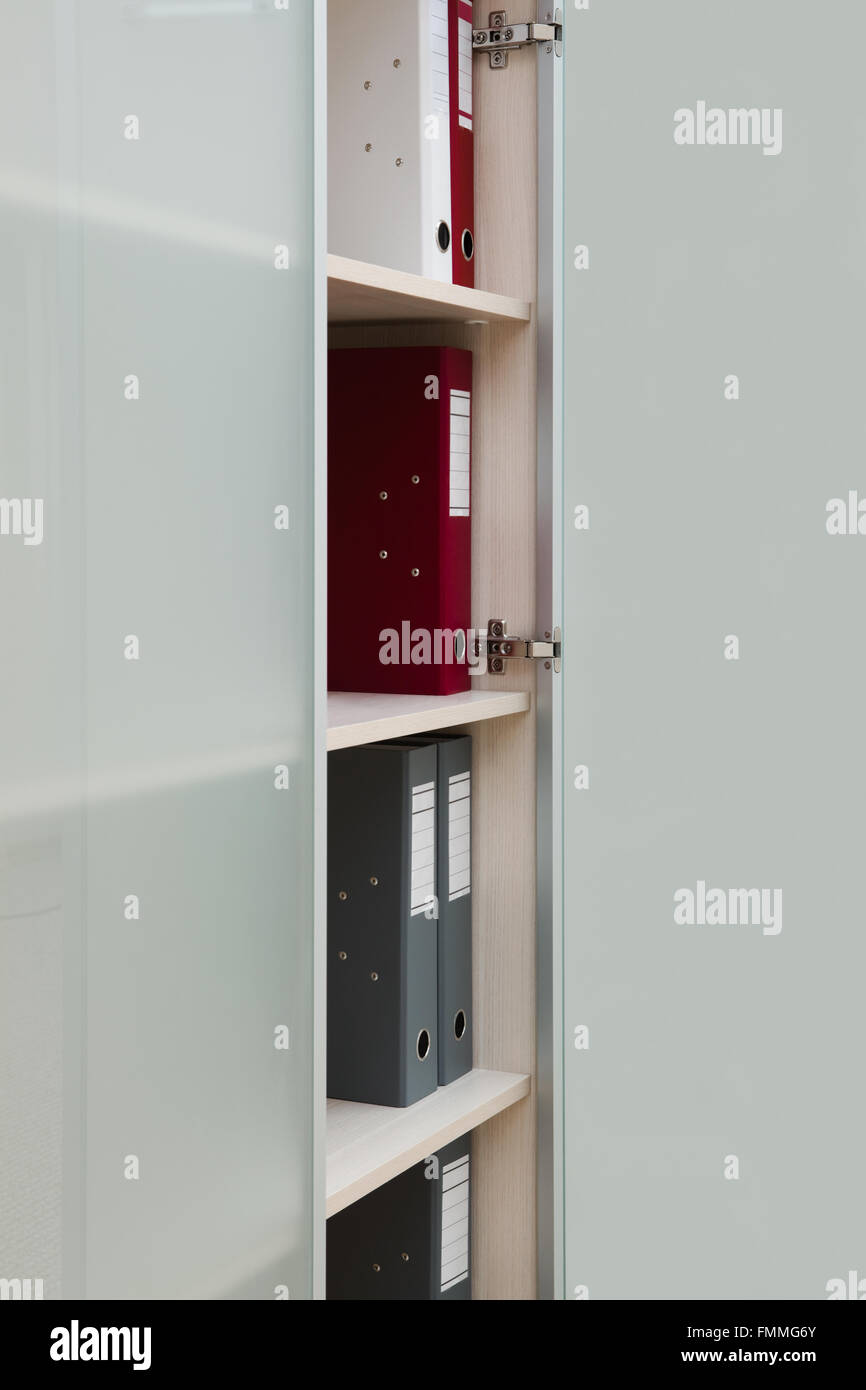 bookcase with folders for papers in the modern office Stock Photo - Alamy