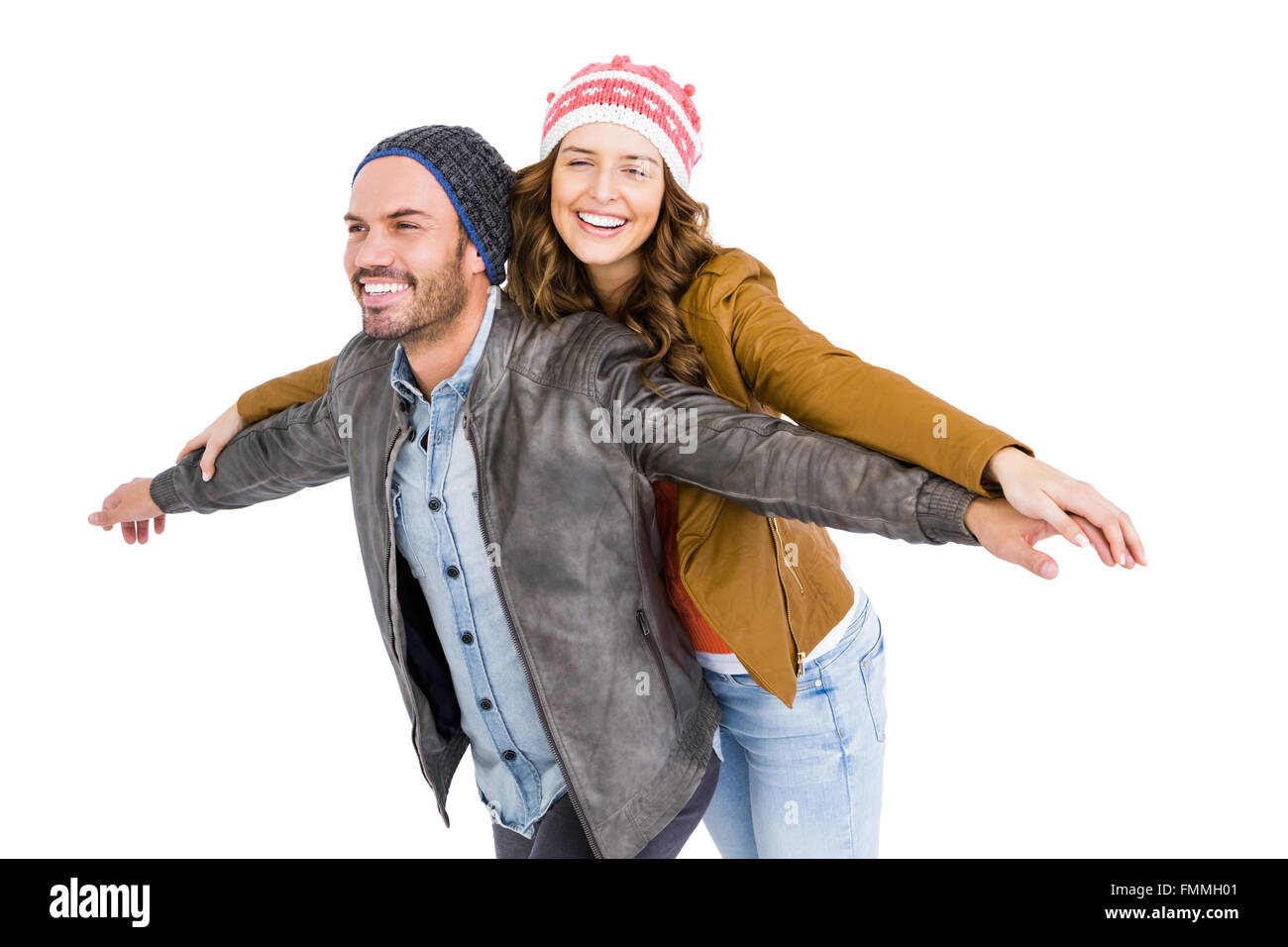 Young couple standing with arms outstretched Stock Photo - Alamy