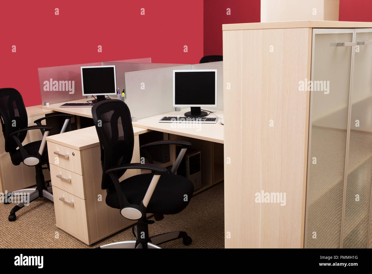 computers behind the glass in a modern office Stock Photo - Alamy