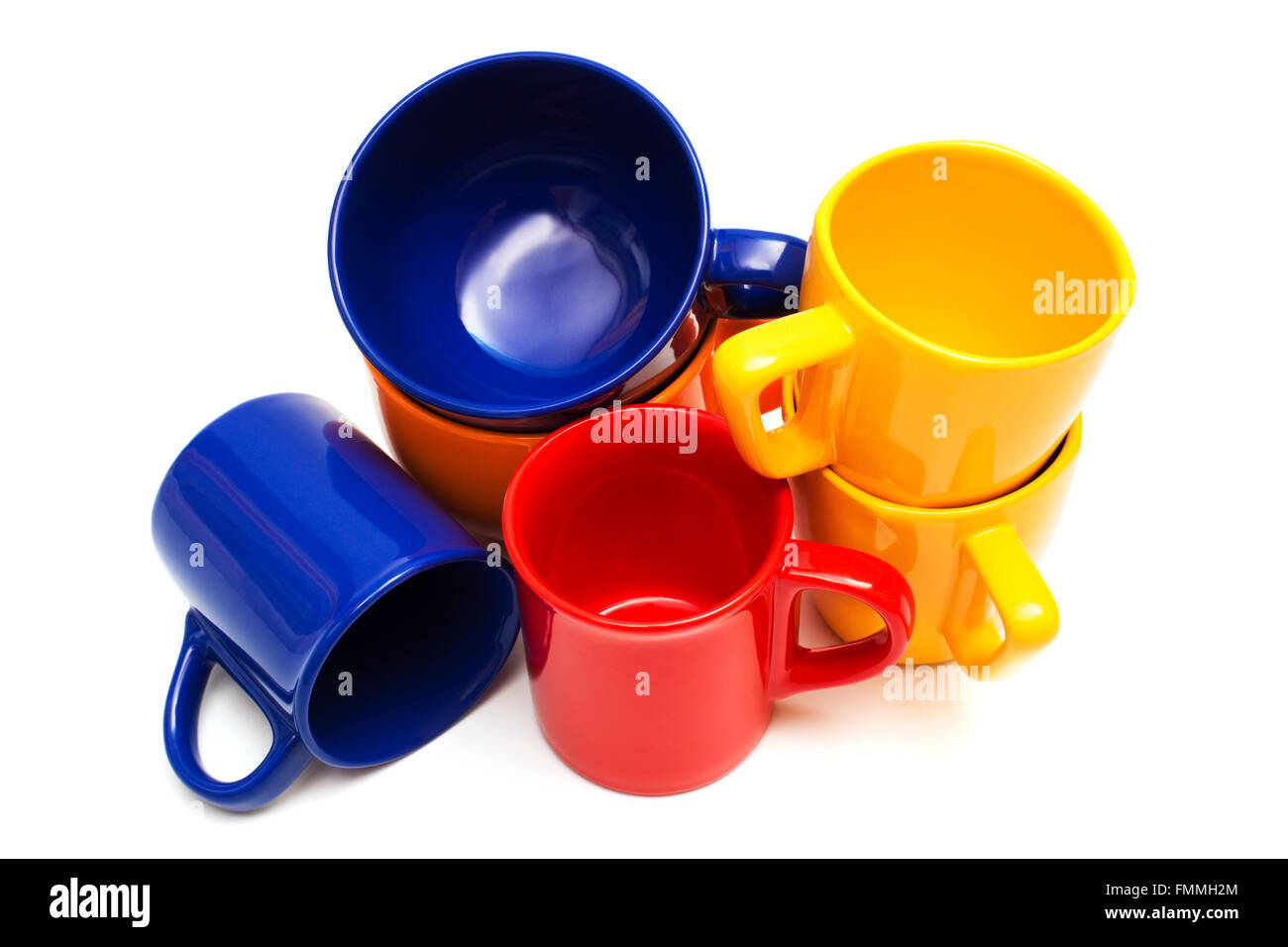 Beautiful color cups on a white background Stock Photo - Alamy