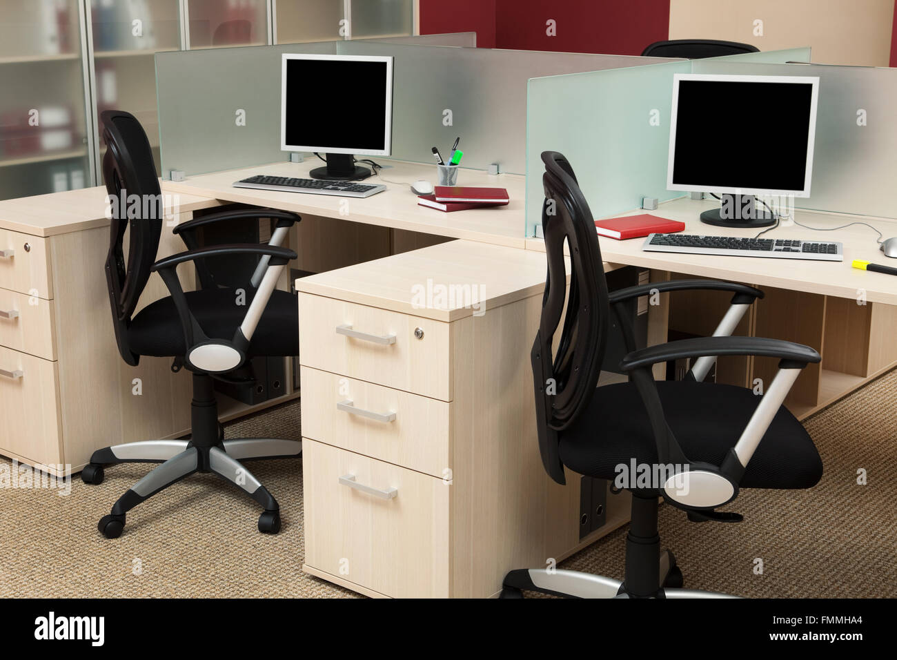 computers behind the glass in a modern office Stock Photo - Alamy