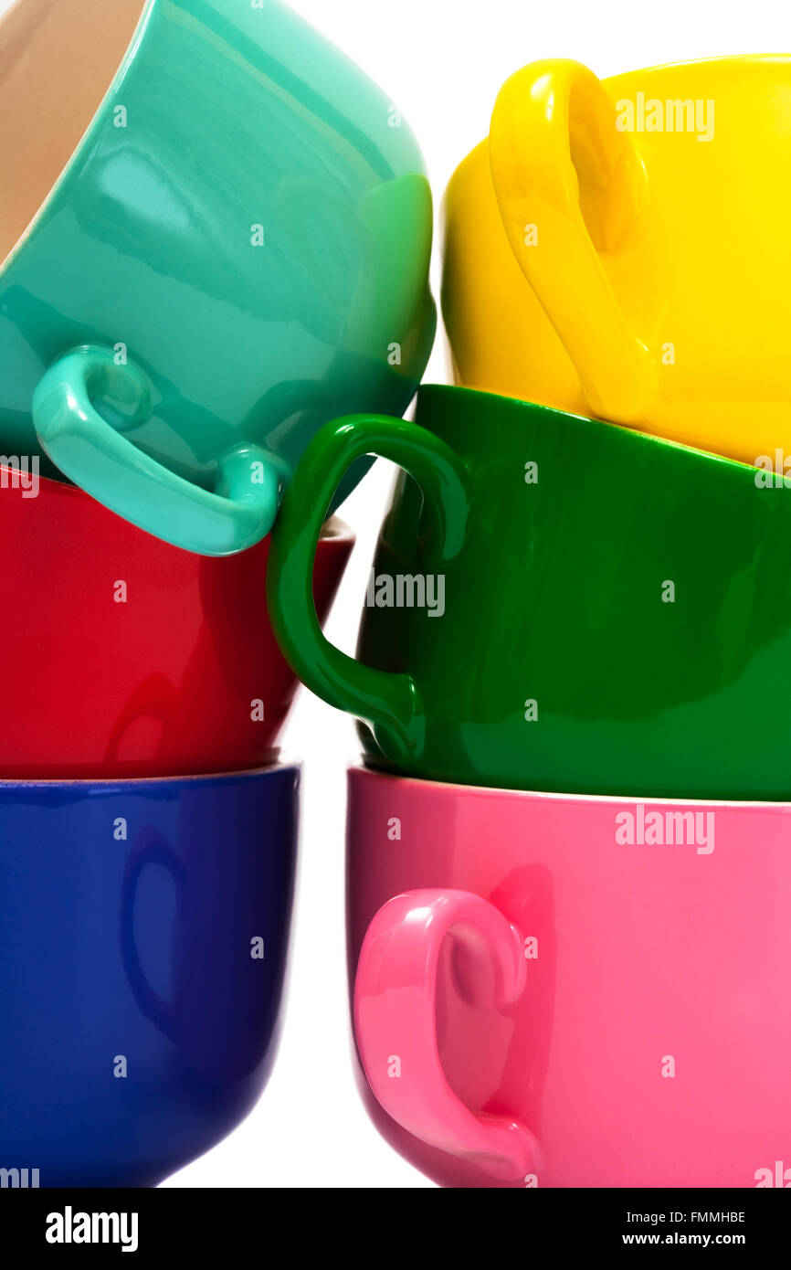 Beautiful color cups on a white background Stock Photo - Alamy