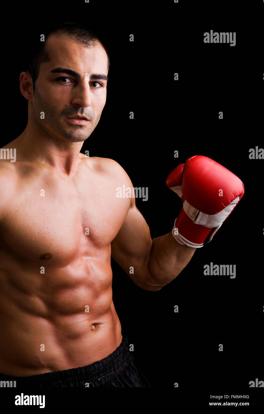Young Boxer fighter over black background Stock Photo - Alamy