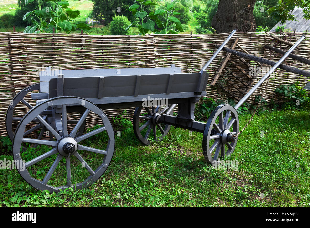 old and a wooden telega at the fence Stock Photo - Alamy