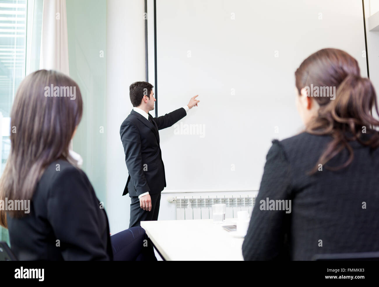 Business man making a presentation at the office Stock Photo - Alamy