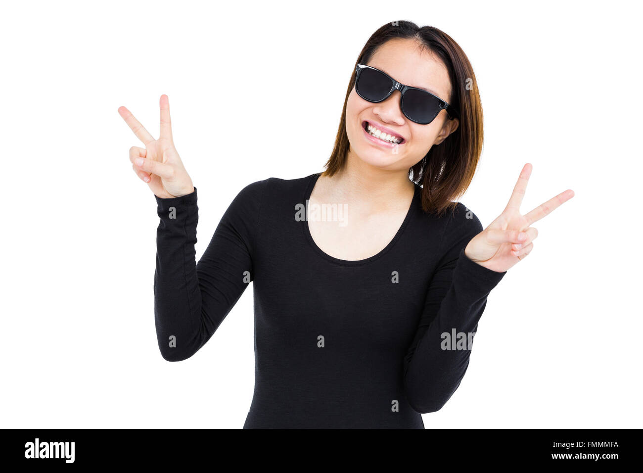 Woman in sunglasses making a v sign Stock Photo - Alamy