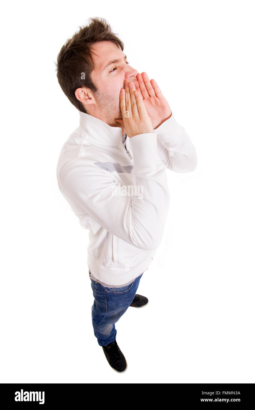 Young man shouting loud with hands on the mouth, isolated on white ...
