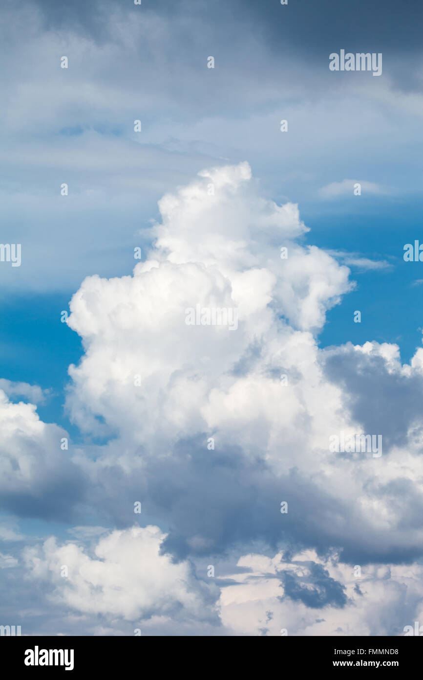 White fluffy storm clouds pillar in blue sky Stock Photo - Alamy