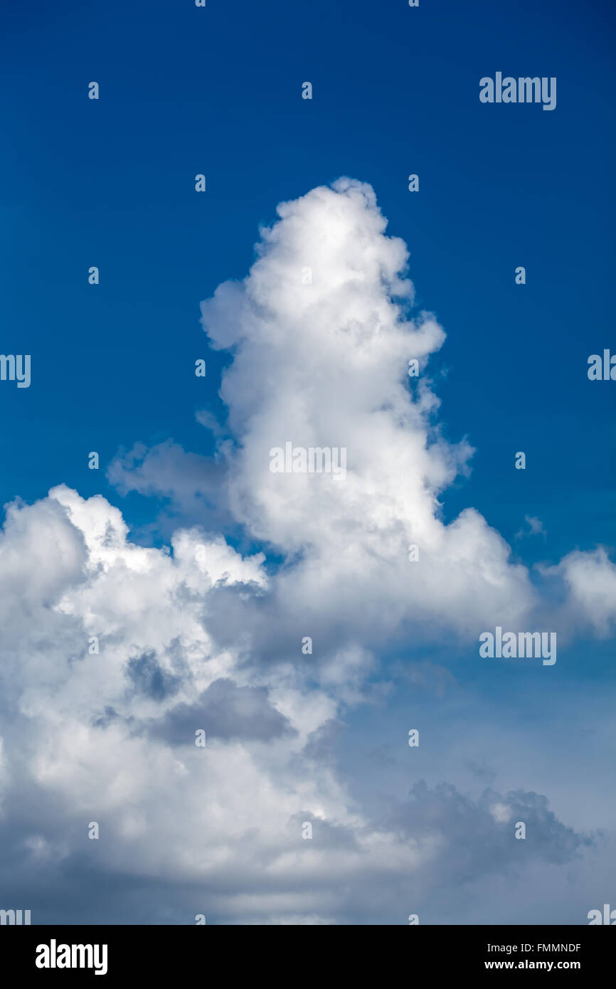 White fluffy storm clouds pillar in blue sky Stock Photo - Alamy
