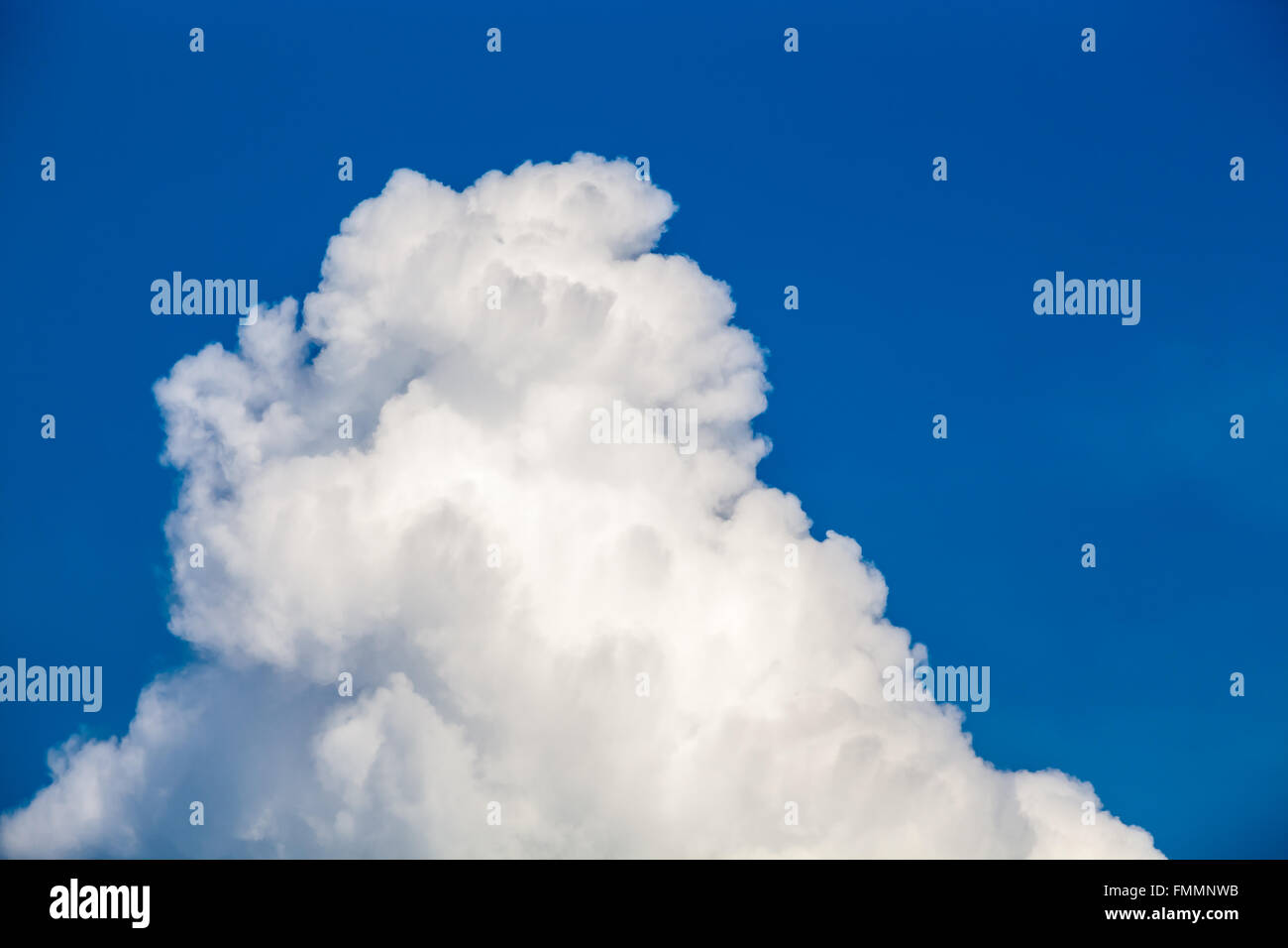 White fluffy clouds pillar in blue sky Stock Photo - Alamy