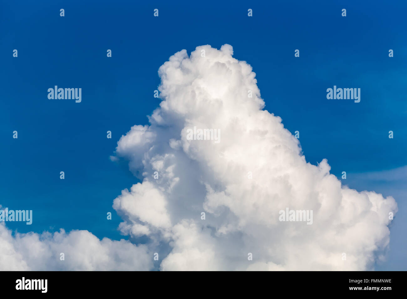 White fluffy clouds pillar in blue sky Stock Photo - Alamy
