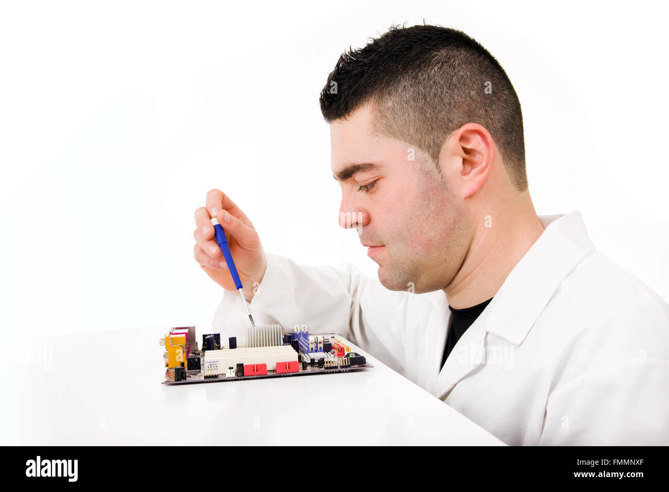 Computer Engineer examining/repairing a electronic circuit, isolated ...