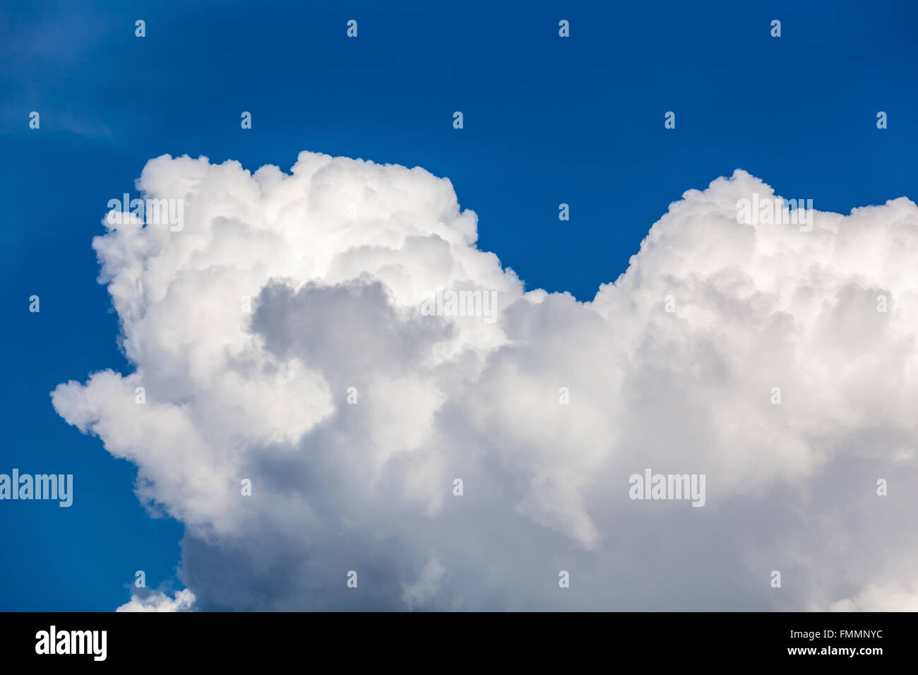 White fluffy clouds pillar in blue sky Stock Photo - Alamy