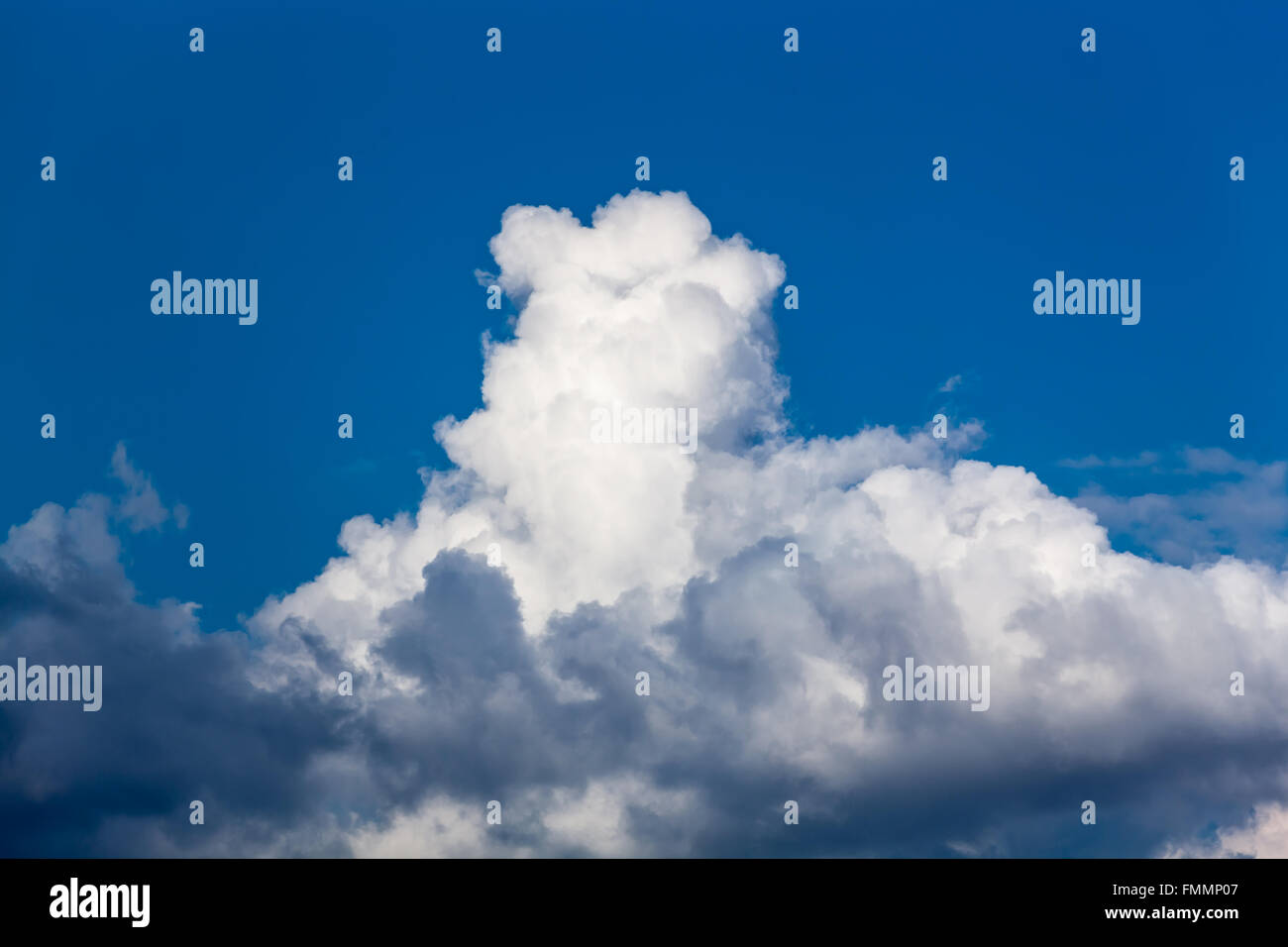 White fluffy storm clouds pillar in blue sky Stock Photo - Alamy