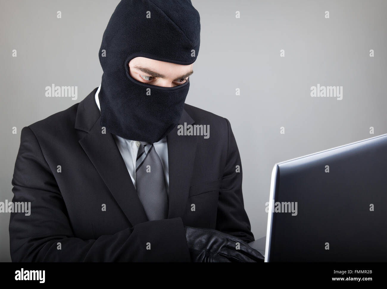 Computer Hacker in suit and tie Stock Photo - Alamy