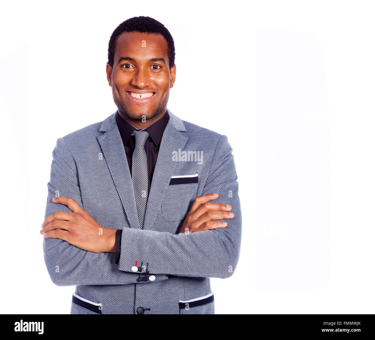 Portrait of a smiling young African business man, isolated on white ...