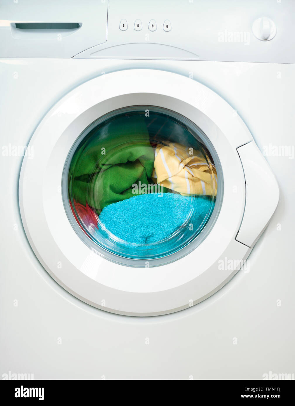 Washing machine with dirty clothes inside, studio shot Stock Photo - Alamy