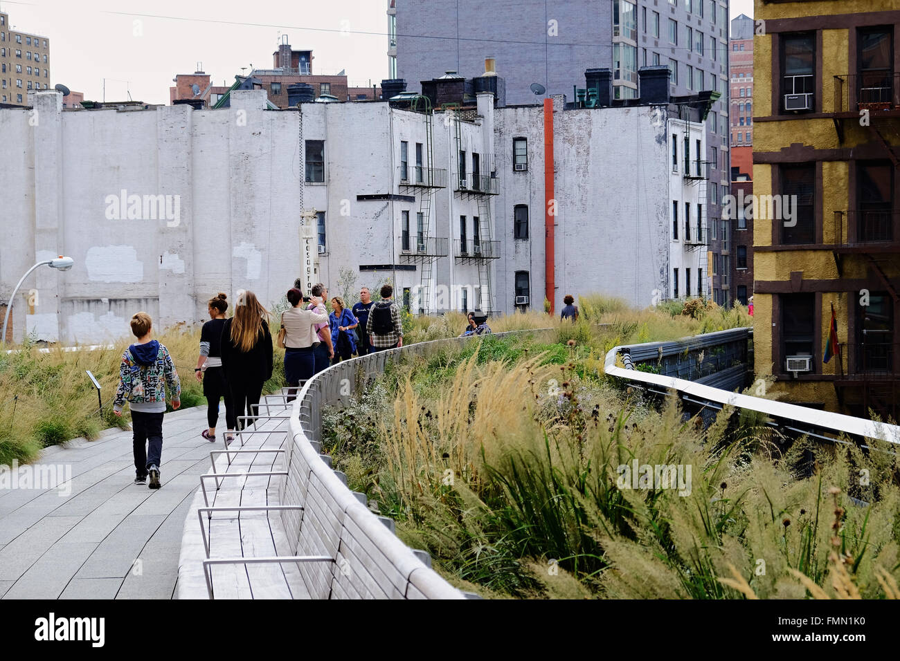 Tourists walking the old rail track called the High Line in west side ...