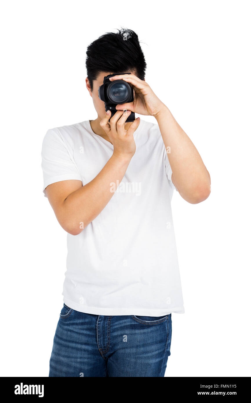Man photographing with camera Stock Photo - Alamy