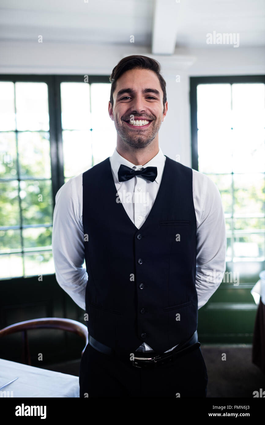 Portrait of waiter smiling at camera Stock Photo - Alamy