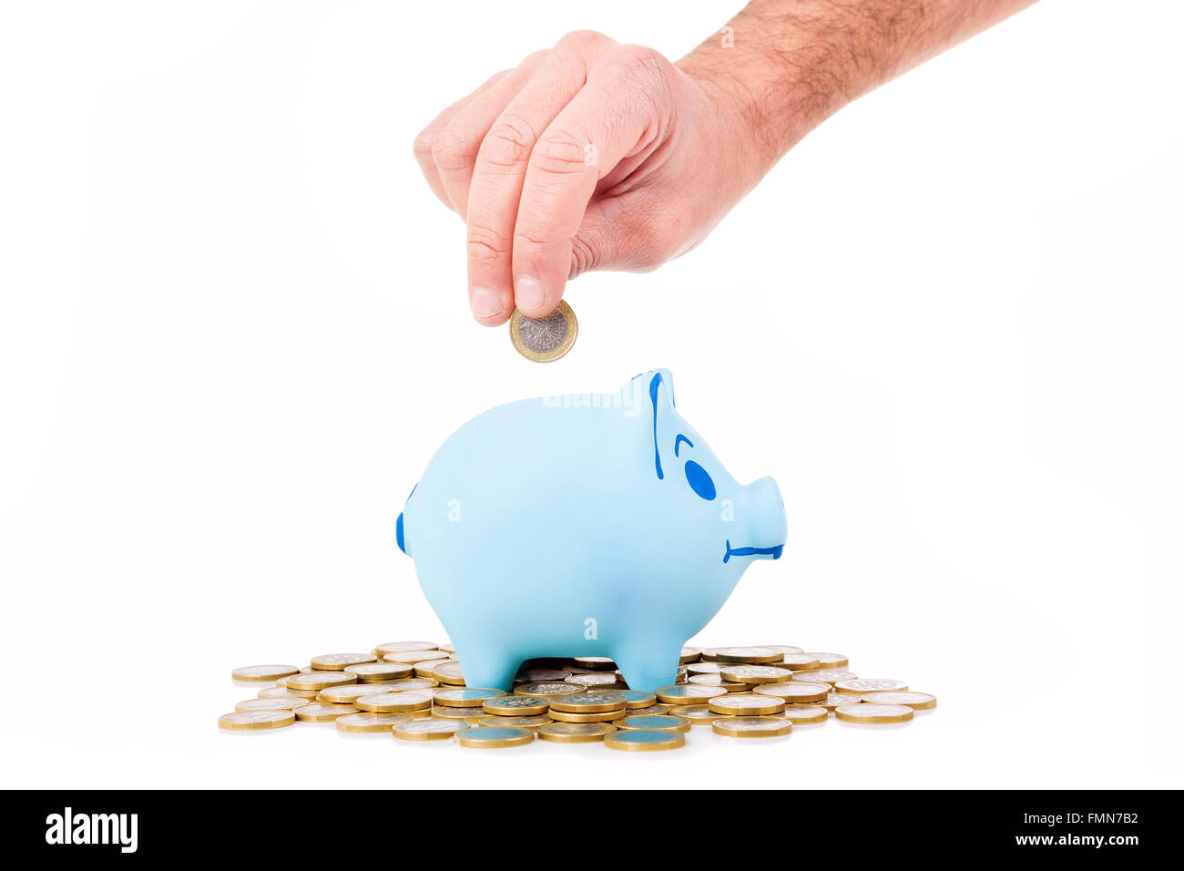 Hand insert coin into the piggy bank, isolated on white Stock Photo - Alamy
