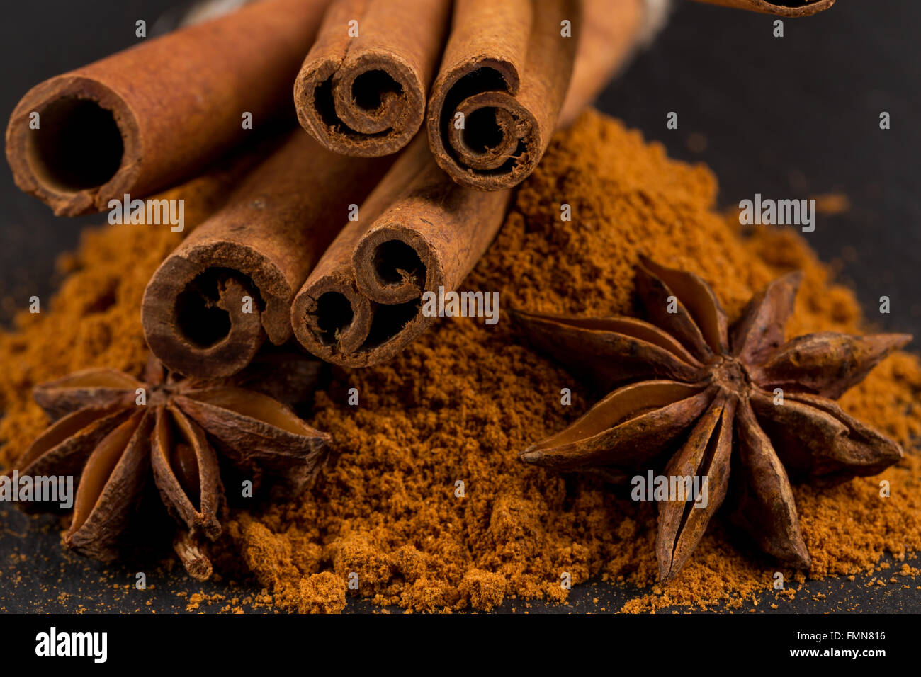 Anise and cinnamon close up on dark stone Stock Photo - Alamy