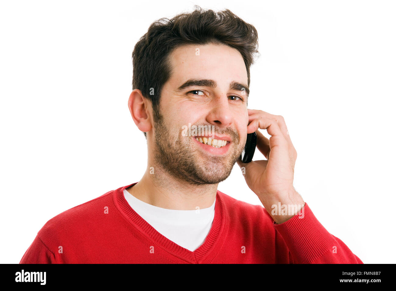 Handsome Man Portrait Talking At The Cell Phone Isolated On White