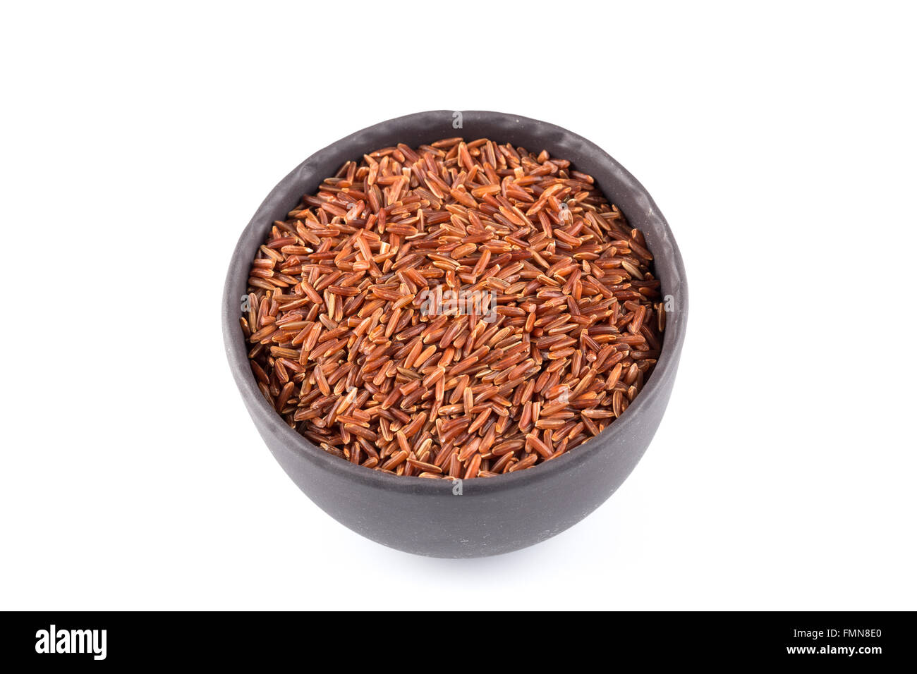 Bowl of Red Cargo Rice. Shot on white background Stock Photo - Alamy