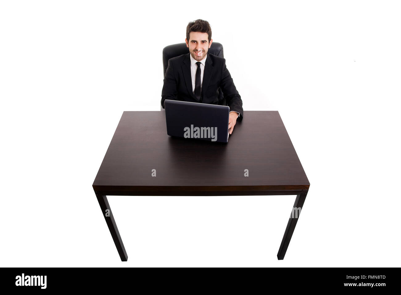 Top view of a young business man working on computer at office desk ...