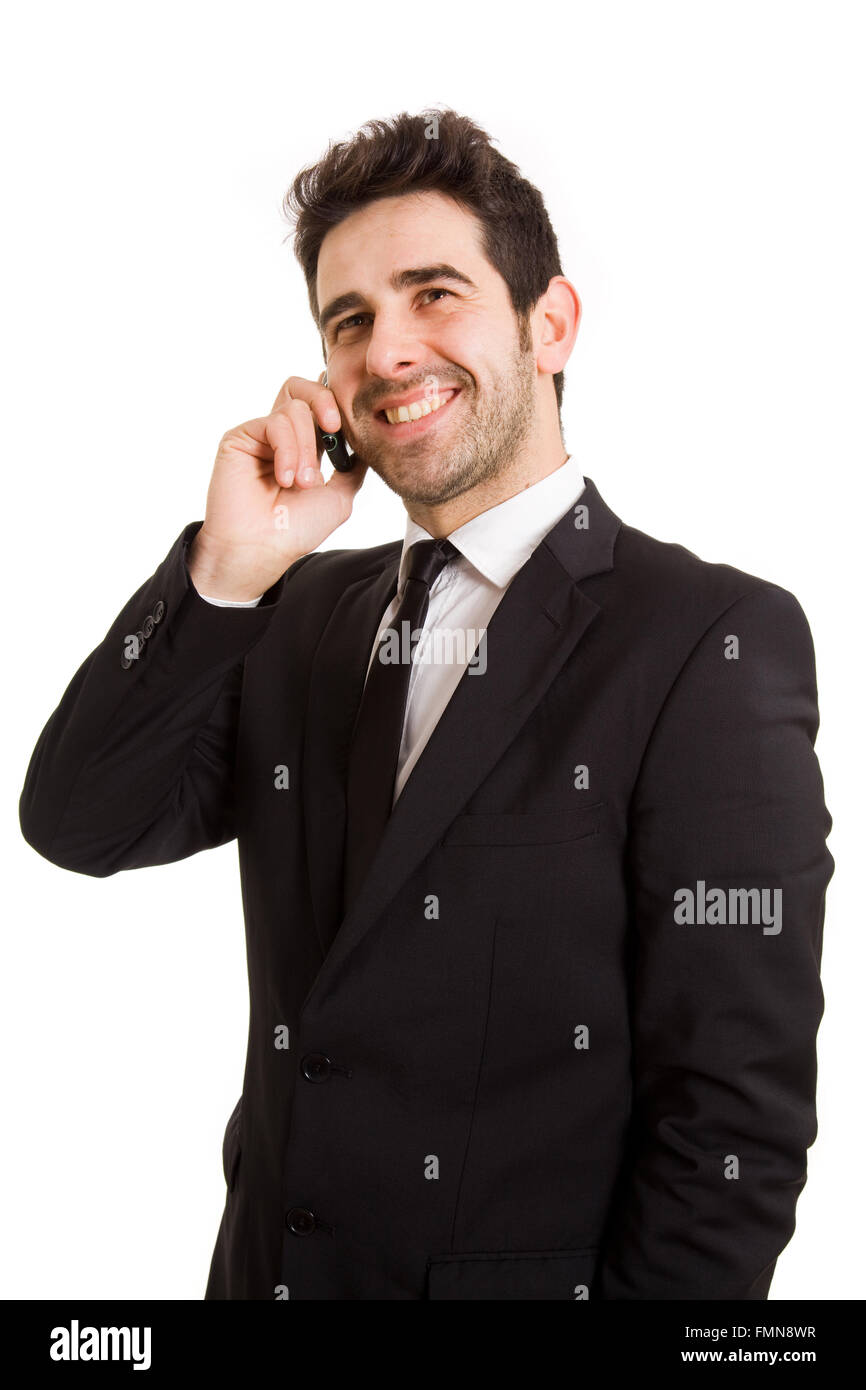 Portrait of a smiling business man with phone, isolated on white ...