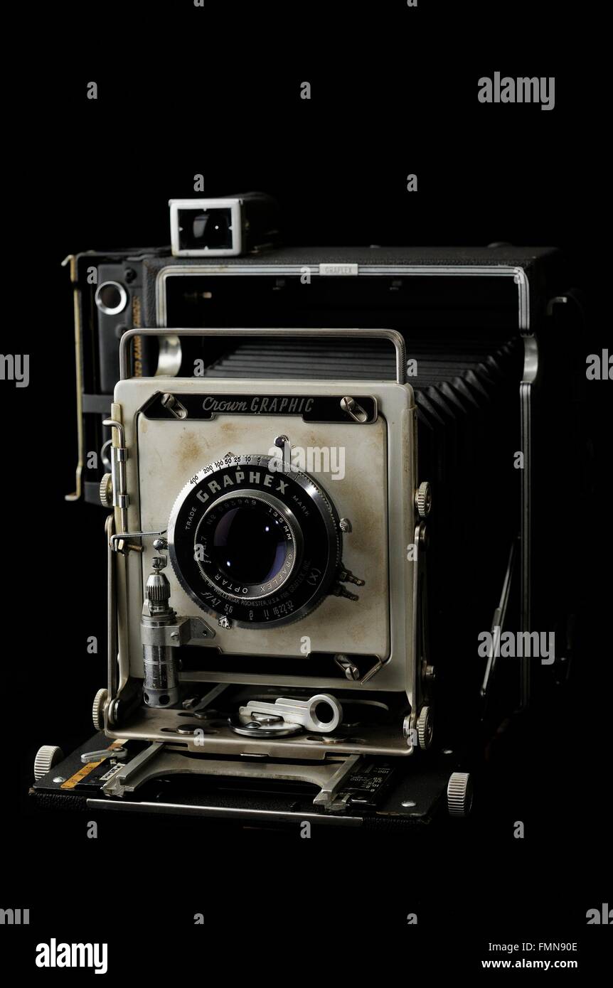 An old Grown Graphic camera on a black background Stock Photo - Alamy