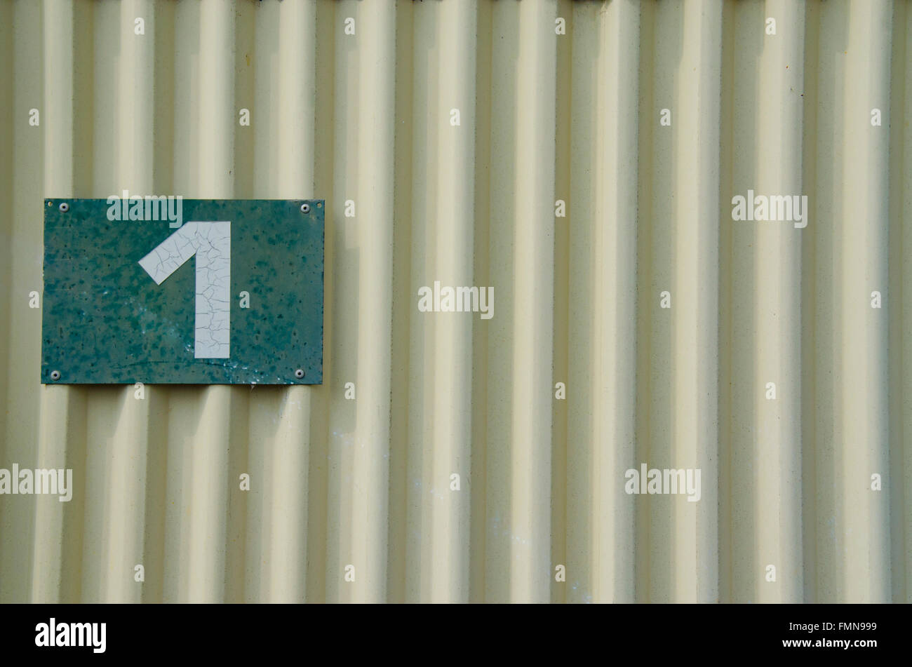 Number 1 on a corrugated steel wall Stock Photo - Alamy