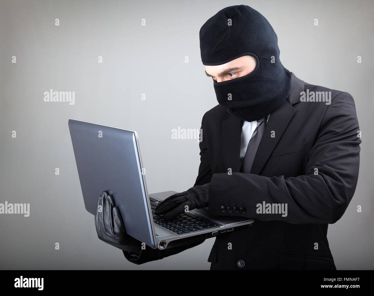 Computer Hacker in suit and tie Stock Photo - Alamy