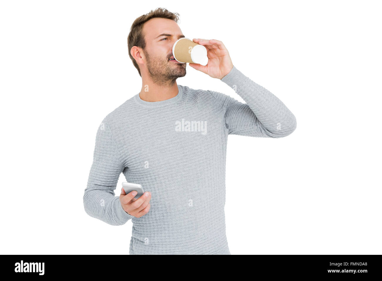Young man having coffee Stock Photo - Alamy