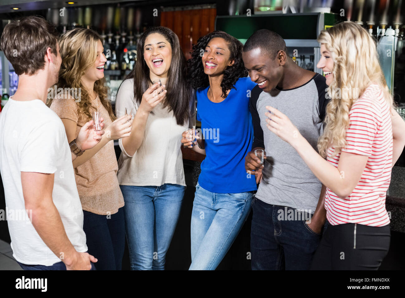 Group of friends drinking shots Stock Photo - Alamy