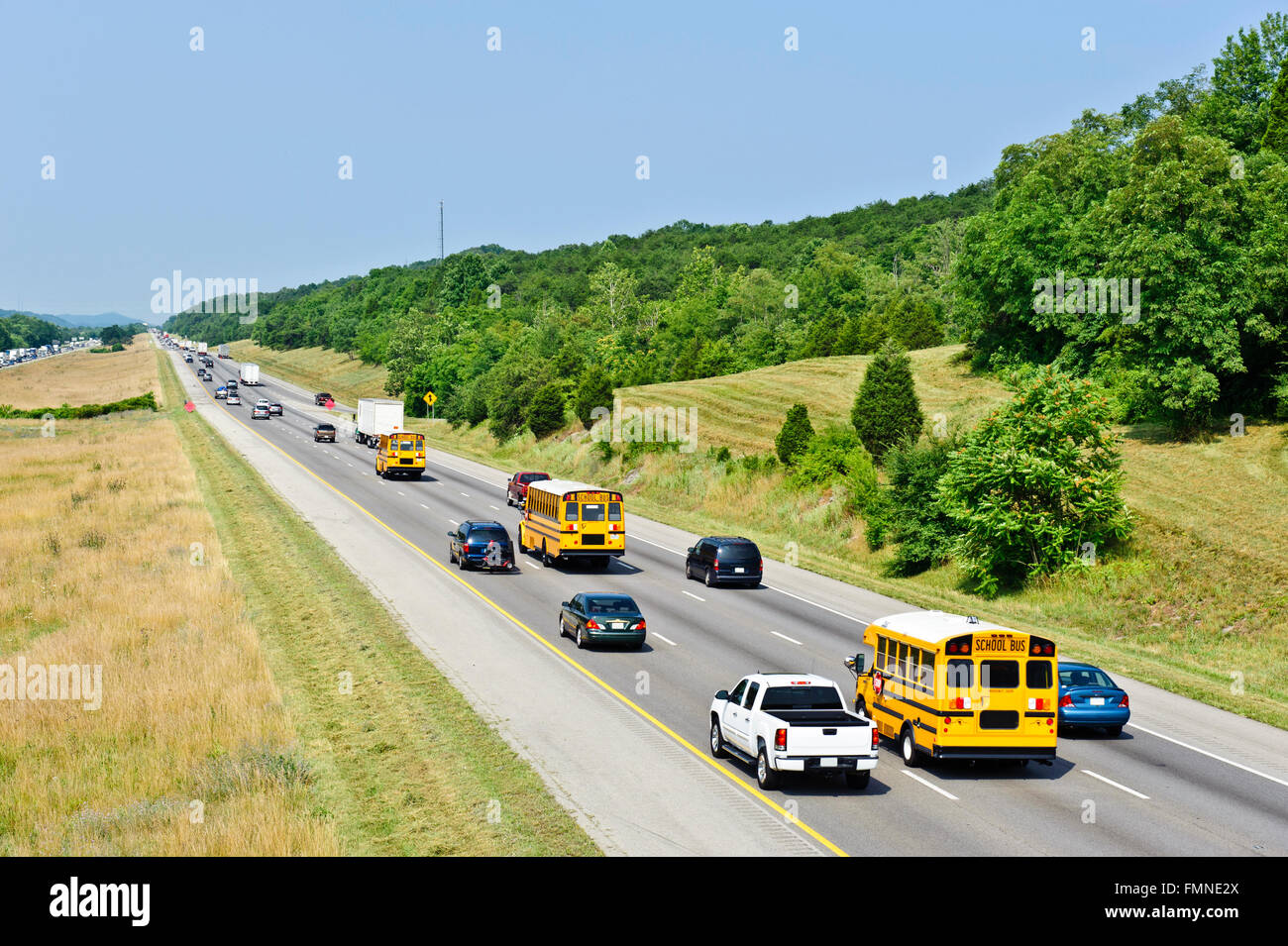 School Buses and Other Traffic On Interstate Highway Stock Photo - Alamy