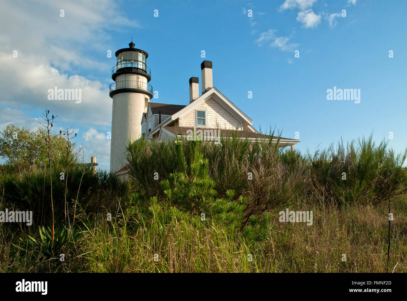 Low angle sun illuminates Highland lighthouse which is surrounded by ...