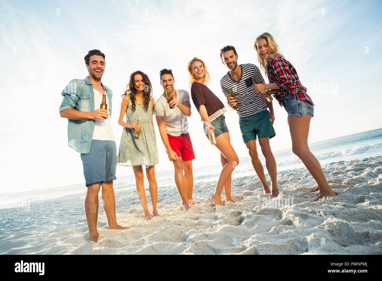 Portrait of friends at the beach Stock Photo - Alamy
