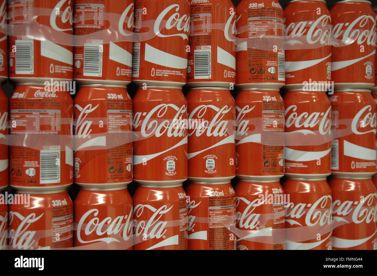 Cola Coca Cans stacked on display in a supermarket Stock Photo - Alamy