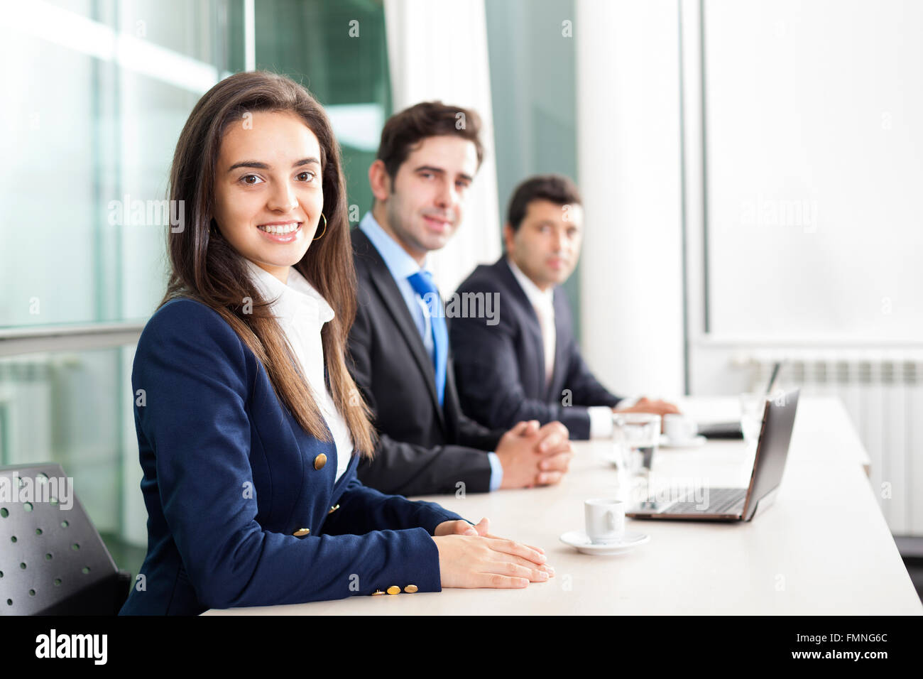 Business team smiling at the office, lined up Stock Photo - Alamy